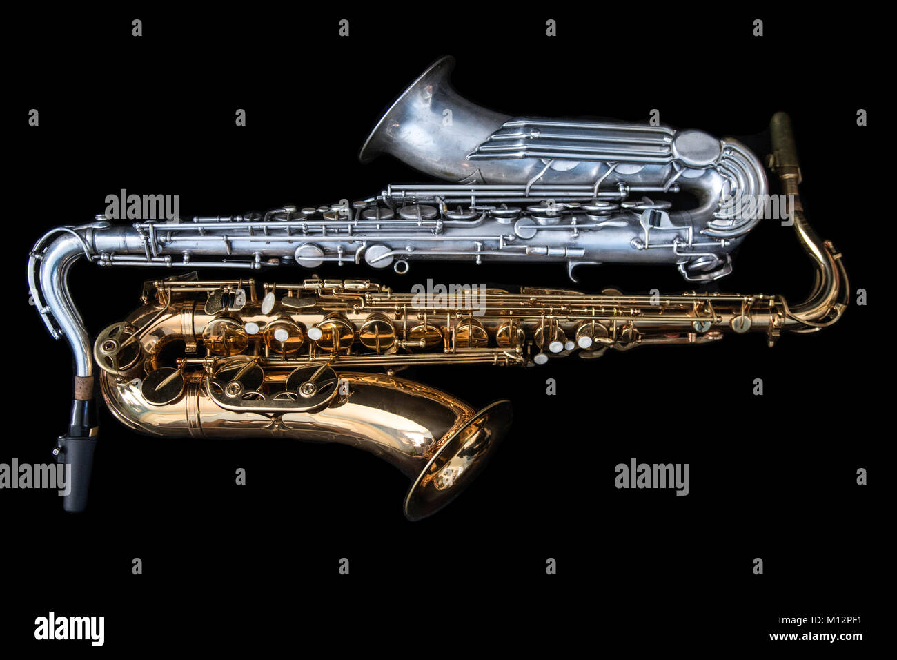 Full view of two saxophones lying down Stock Photo - Alamy
