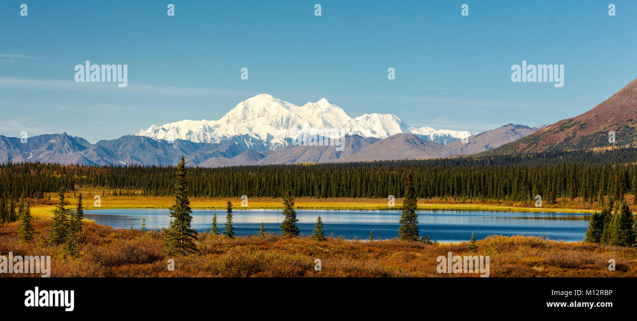 Scenic view of Denali (formerly Mt. McKinley) and pond at Broad Pass ...