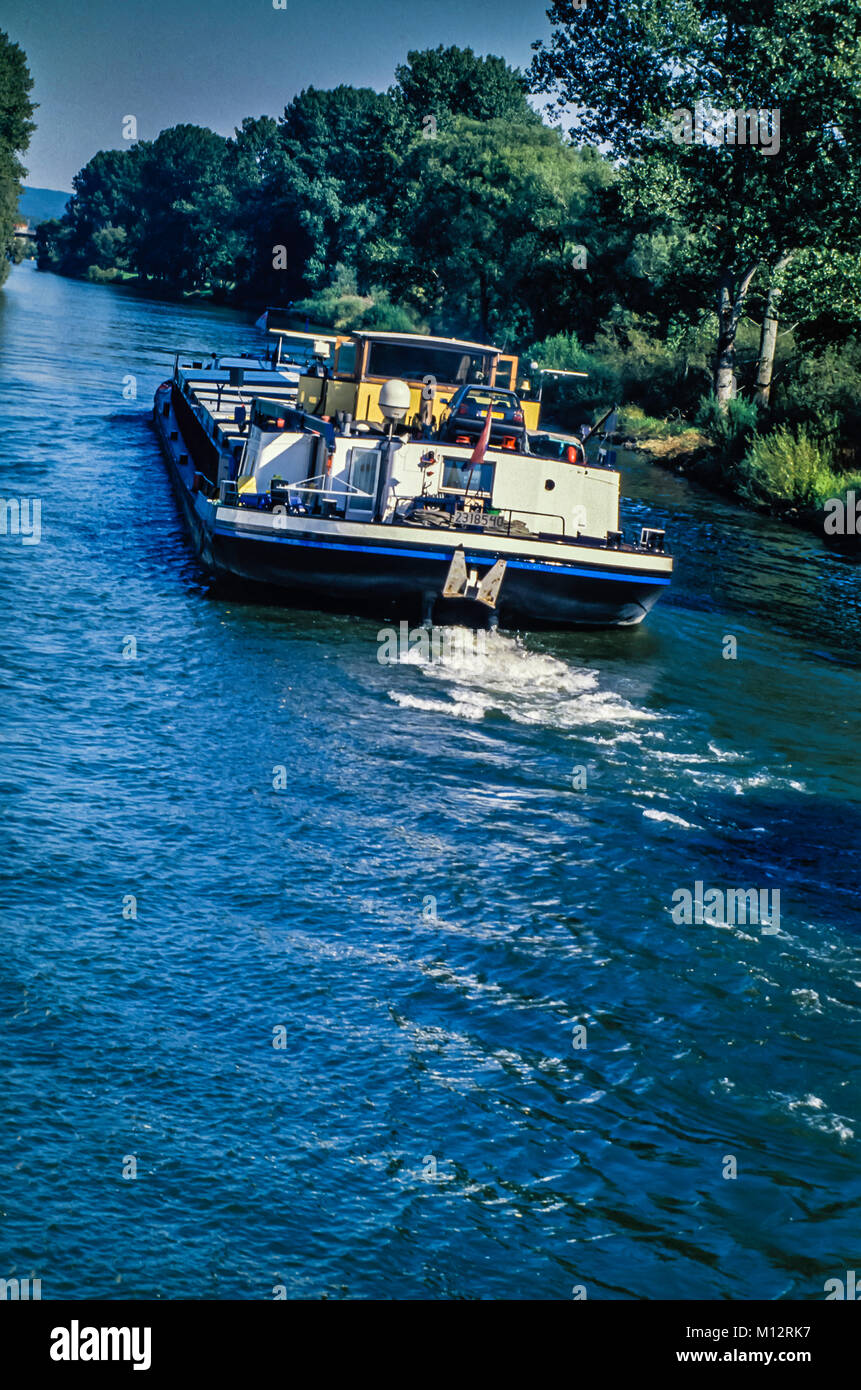 European river cruise and commercial barges Stock Photo - Alamy