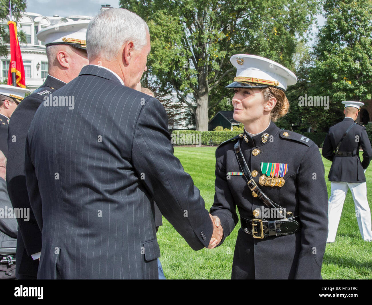 Vice President Mike Pence, left, shakes hands with U.S. Marine Corps ...