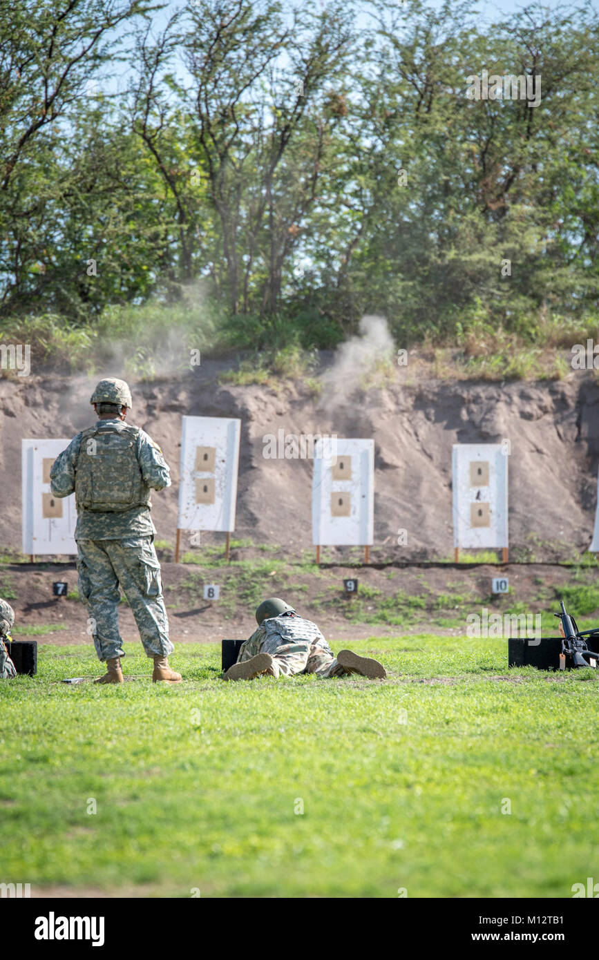 A 103rd Troop Command Soldier fires at their target while conducting ...