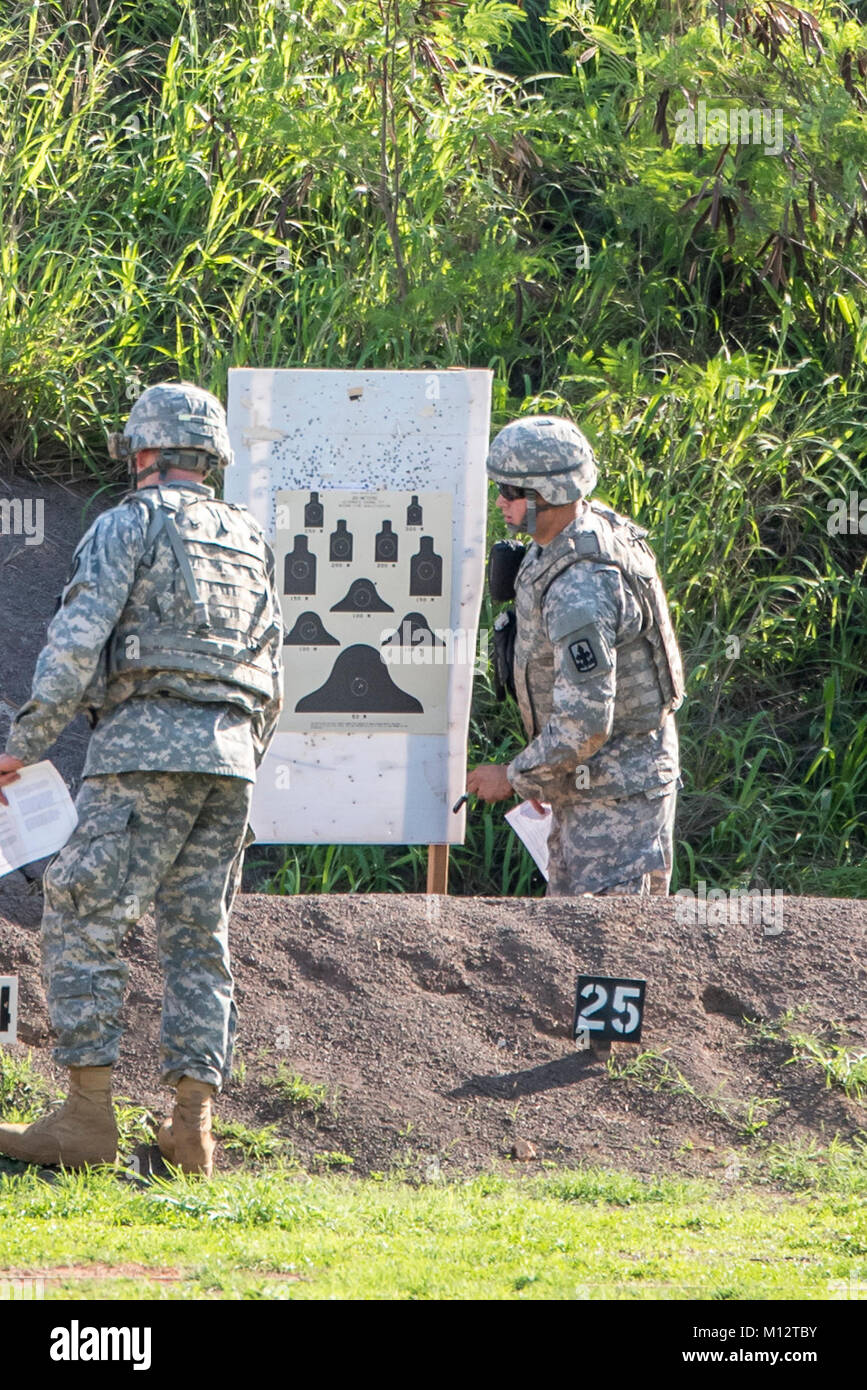 A Soldier of the 103rd Troop Command observes his target at the range ...
