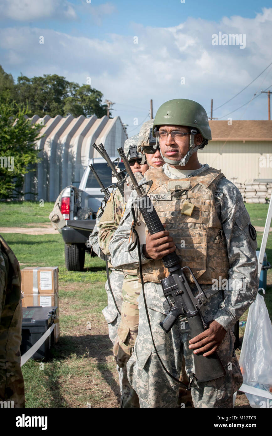 Soldiers of the 103rd Troop Command wait for their turn to qualify at ...