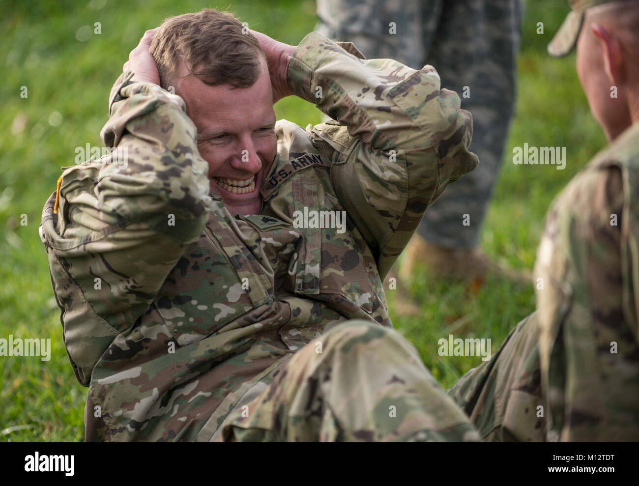 Soldiers conduct a modified Army Physical Fitness Test during the ...