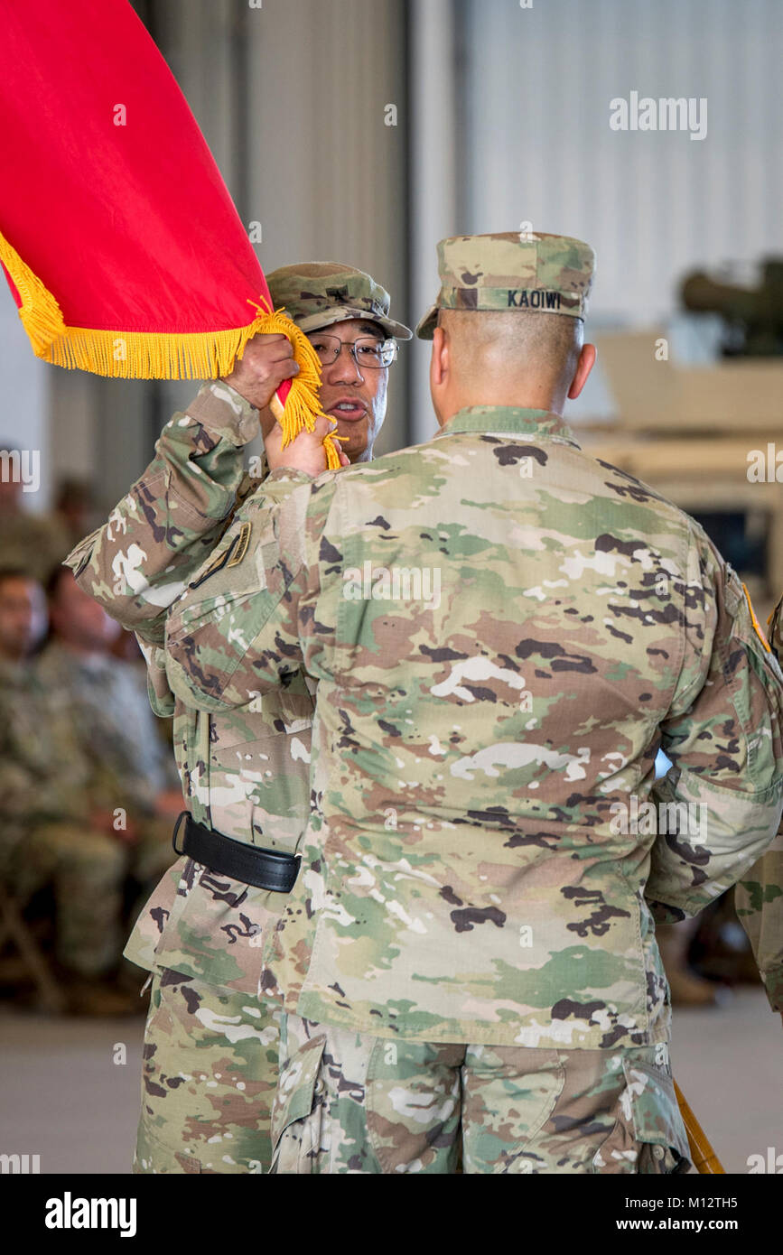 Brig. Gen. Keith Y. Tamashiro speaks to the outgoing commander, Col ...