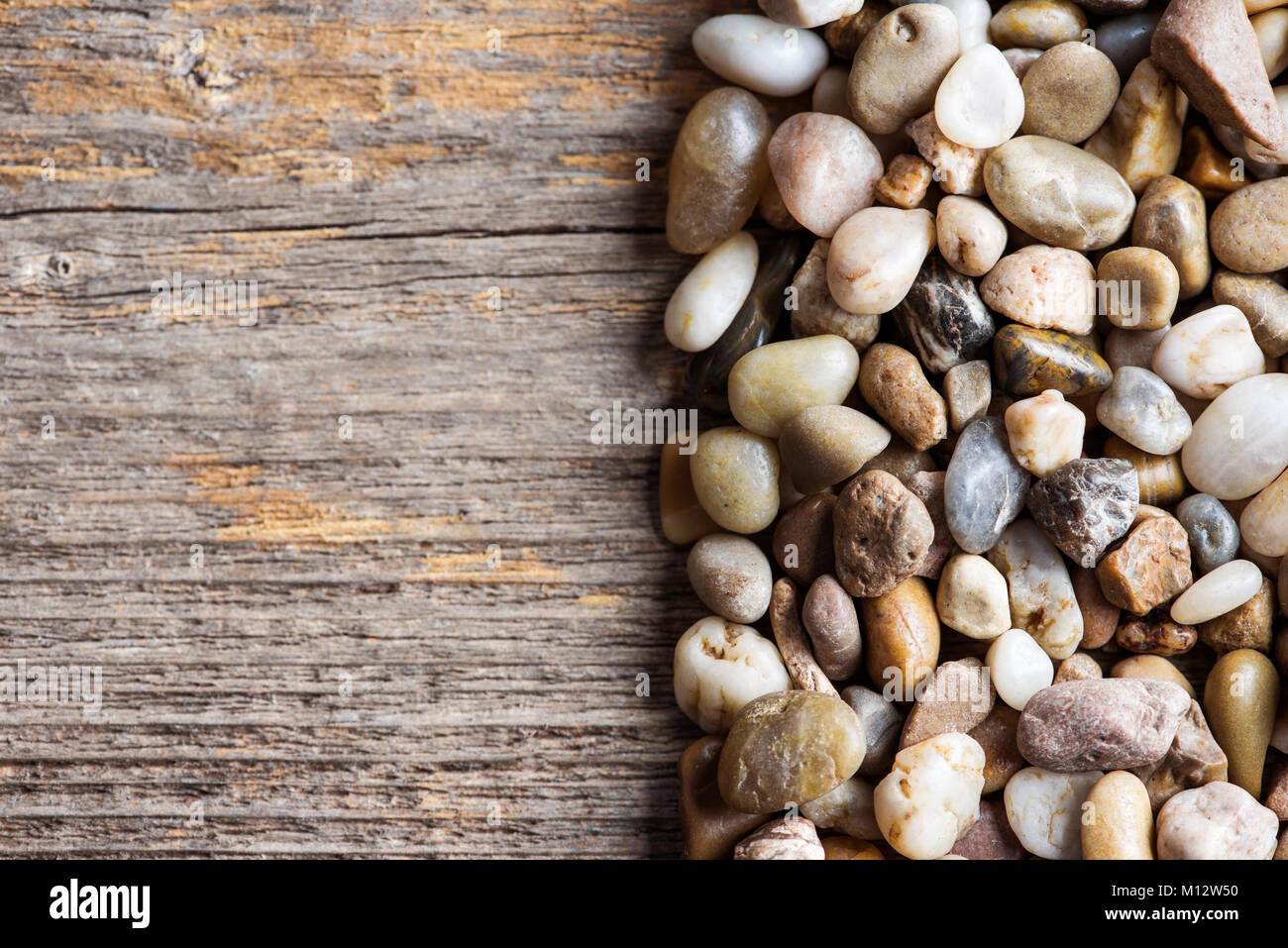 Wood and stones in different colors and shapes Stock Photo - Alamy