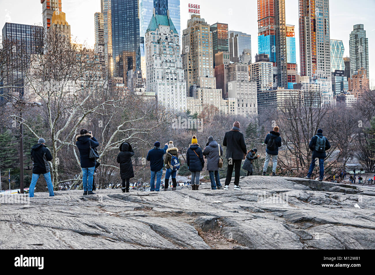 People watching Manhattan buildings from Central park in New York City ...