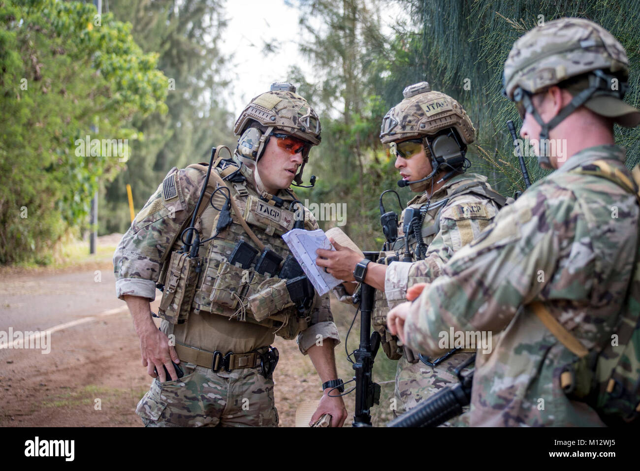 Staff Sgt. David R. Cunningham checks Senior Airman JuJuan D. Howard's ...