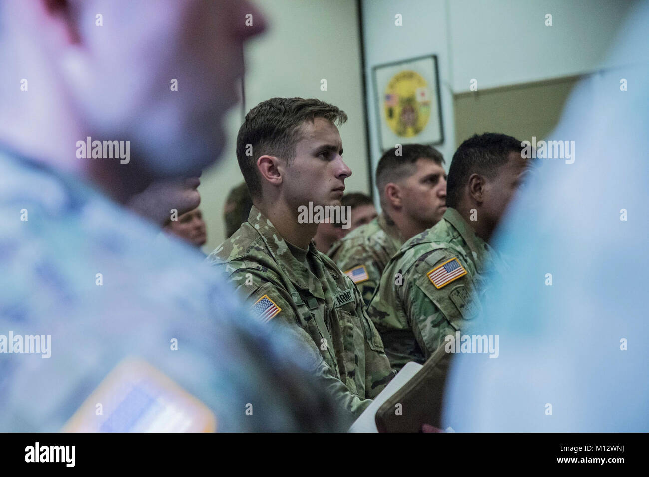 U.S. Army 1st Lt. Ben Morgan listens to retired Lt. Gen. Robert F ...