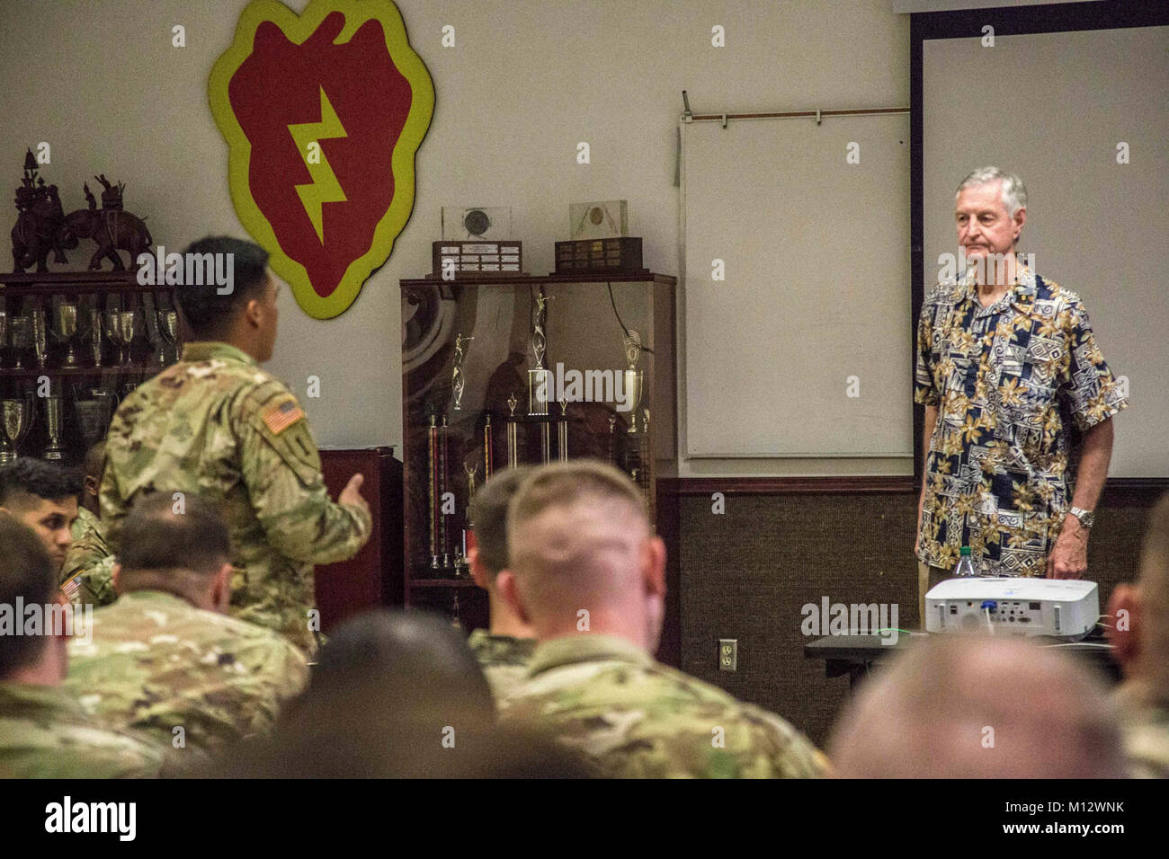 U.S. Army Capt. David Zelaya answers a question posed by retired Lt ...