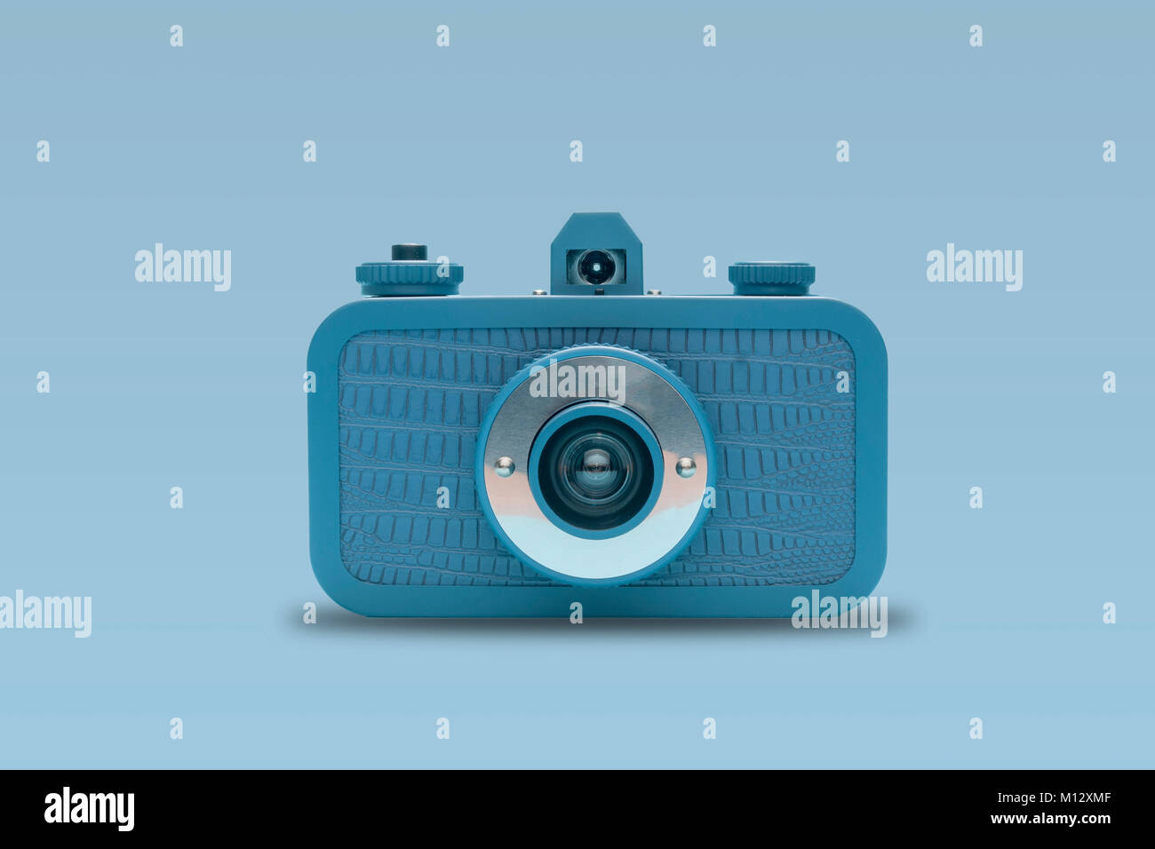 Plastic blue vintage film camera on pastel background Stock Photo - Alamy