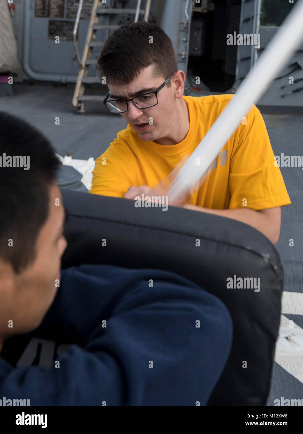 OCEAN (Jan. 22, 2018) Fireman Scott Tyler, right, practices defensive ...