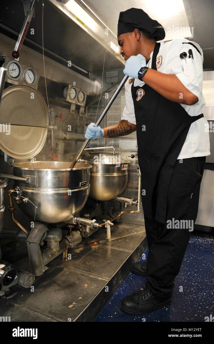 DIEGO (Jan. 23, 2018) Culinary Specialist Seaman Tyrell Wilson prepares ...