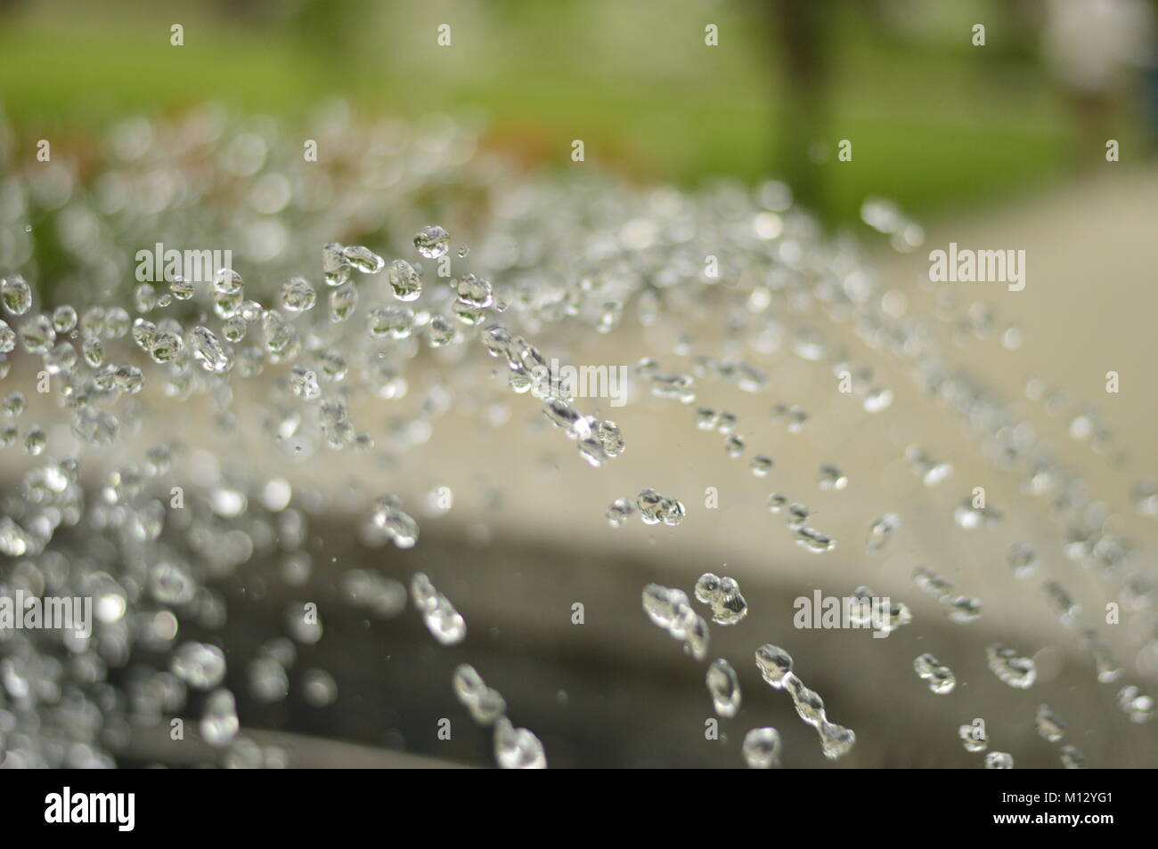 Small and shiny water drops of a fountain Stock Photo - Alamy