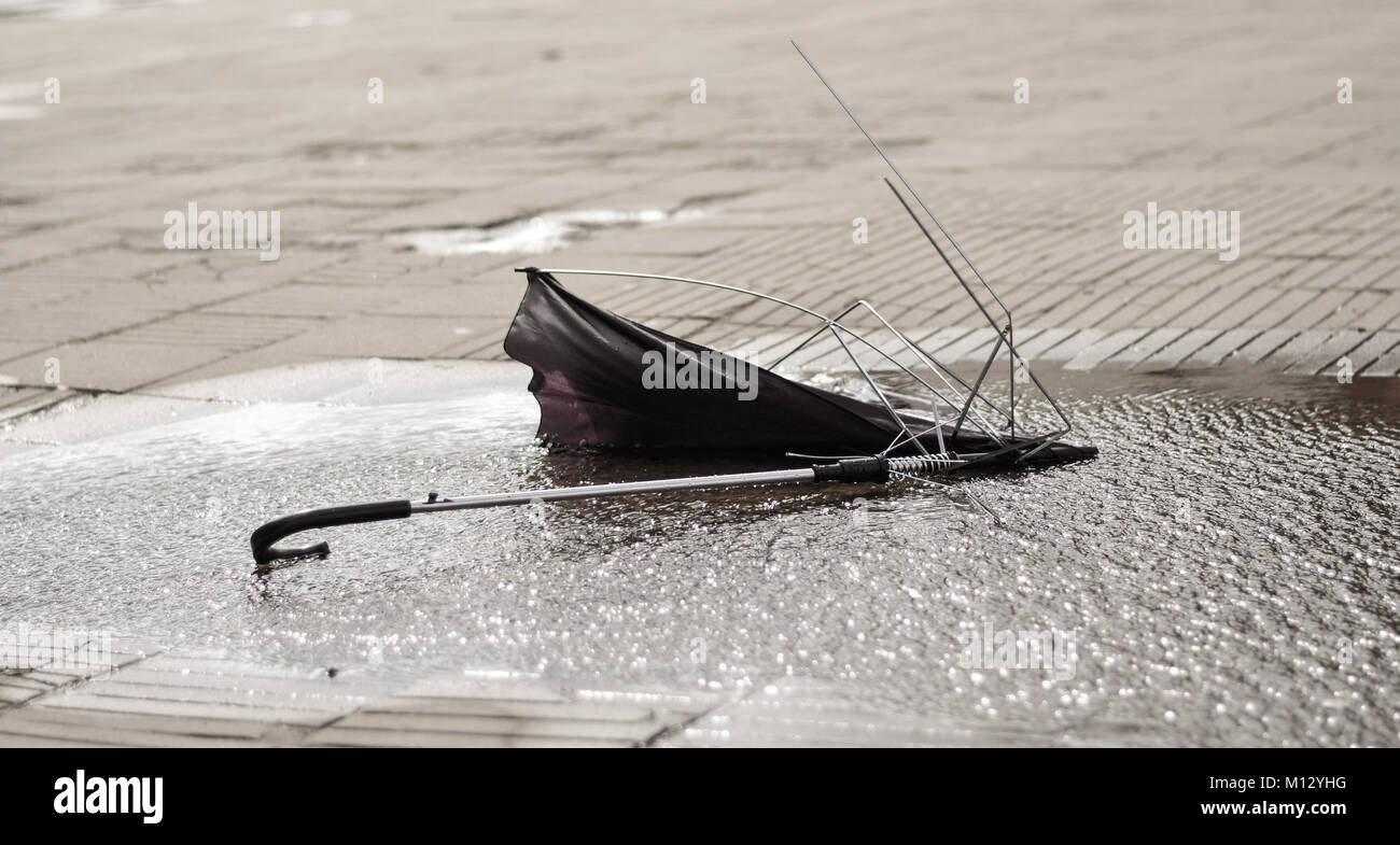 Broken umbrella hi-res stock photography and images - Alamy