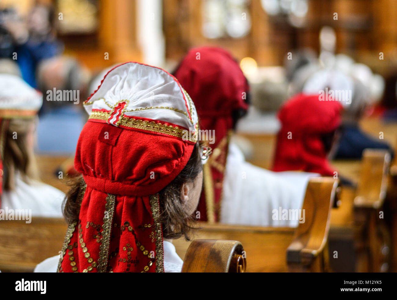 People in traditional clothes in church Stock Photo - Alamy