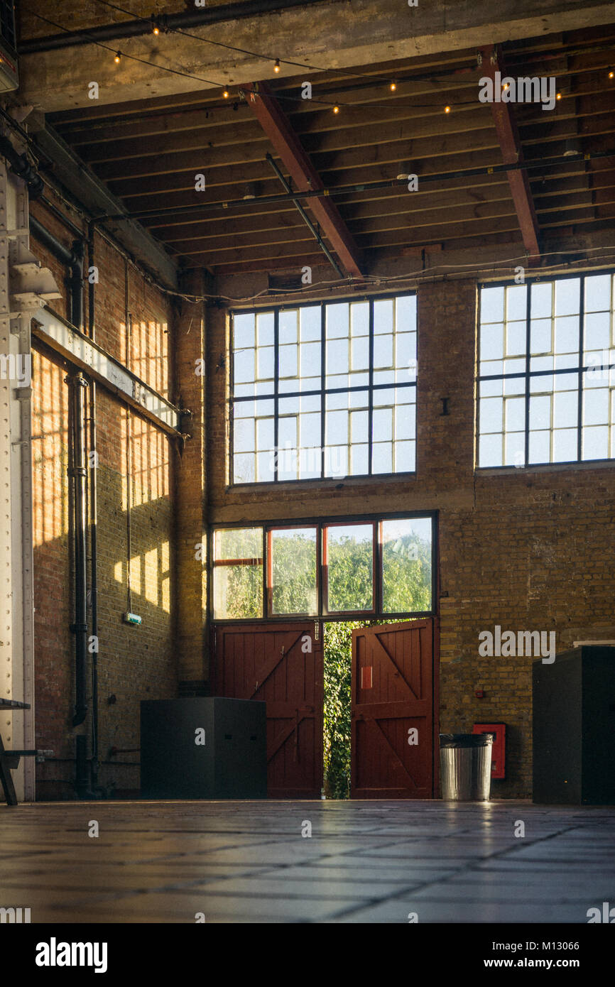Old redecorated light factory building with light trails Stock Photo ...