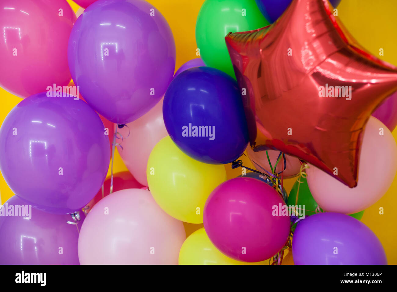 balloons of different colors with gifts for the holiday Stock Photo - Alamy