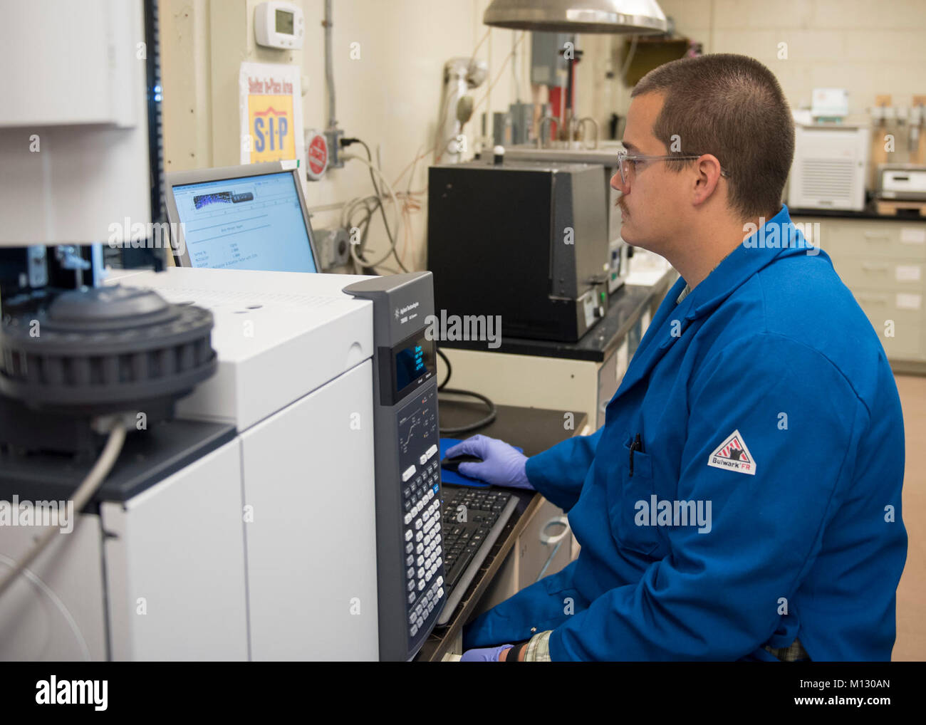 Chris Garduno, Aerospace Fuels Laboratory chemist, analyzes a fuel ...