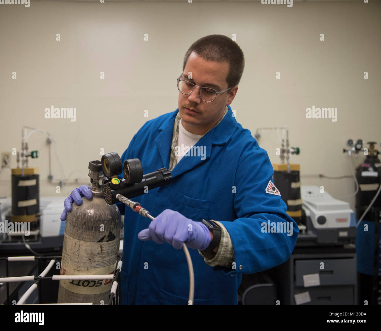 Chris Garduno, Aerospace Fuels Laboratory chemist, prepares a gas ...