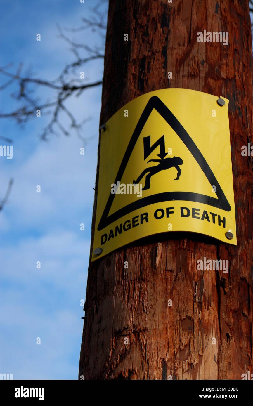 Danger of Death sign on telegraph pole Stock Photo - Alamy