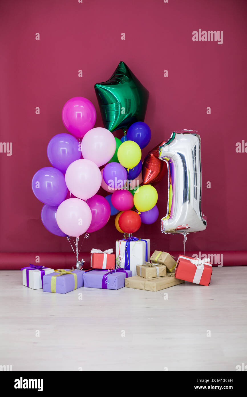 balloons of different colors with gifts for birthday Stock Photo - Alamy