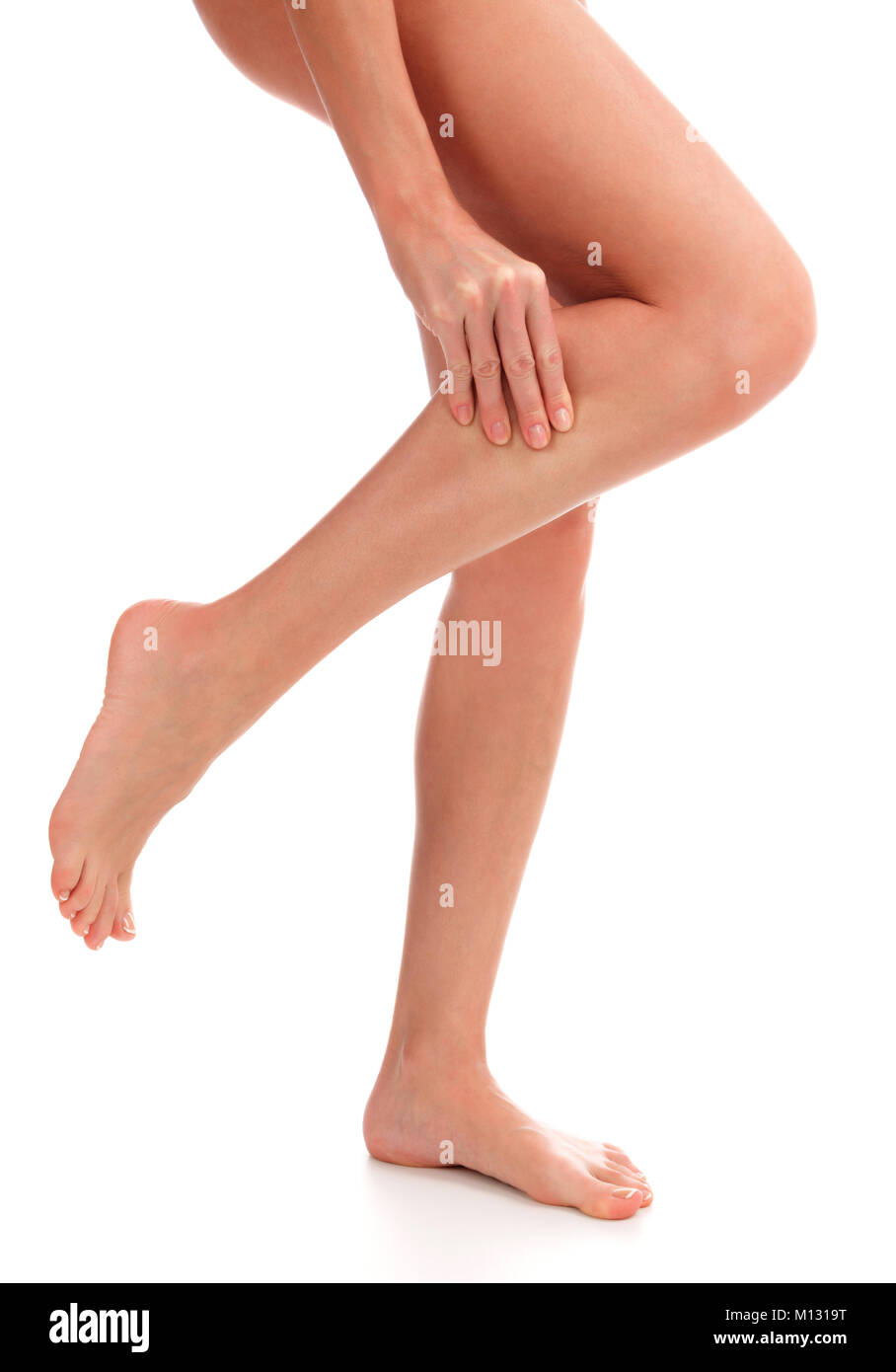 Holding hand touching leg feet hi-res stock photography and images - Alamy