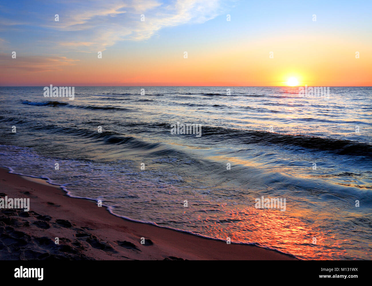 Colorful sunset over the Baltic Sea shore and beach in Rowy, Poland ...