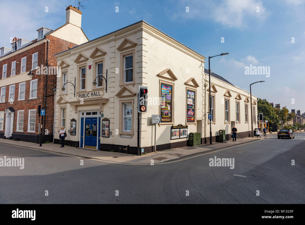 A woman looks at posters on the wall of Beccles Public Hall and Theatre ...