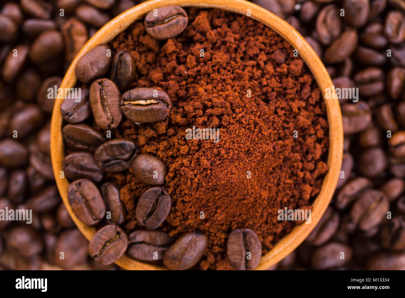 roasted brown coffee beans and powder background Stock Photo - Alamy