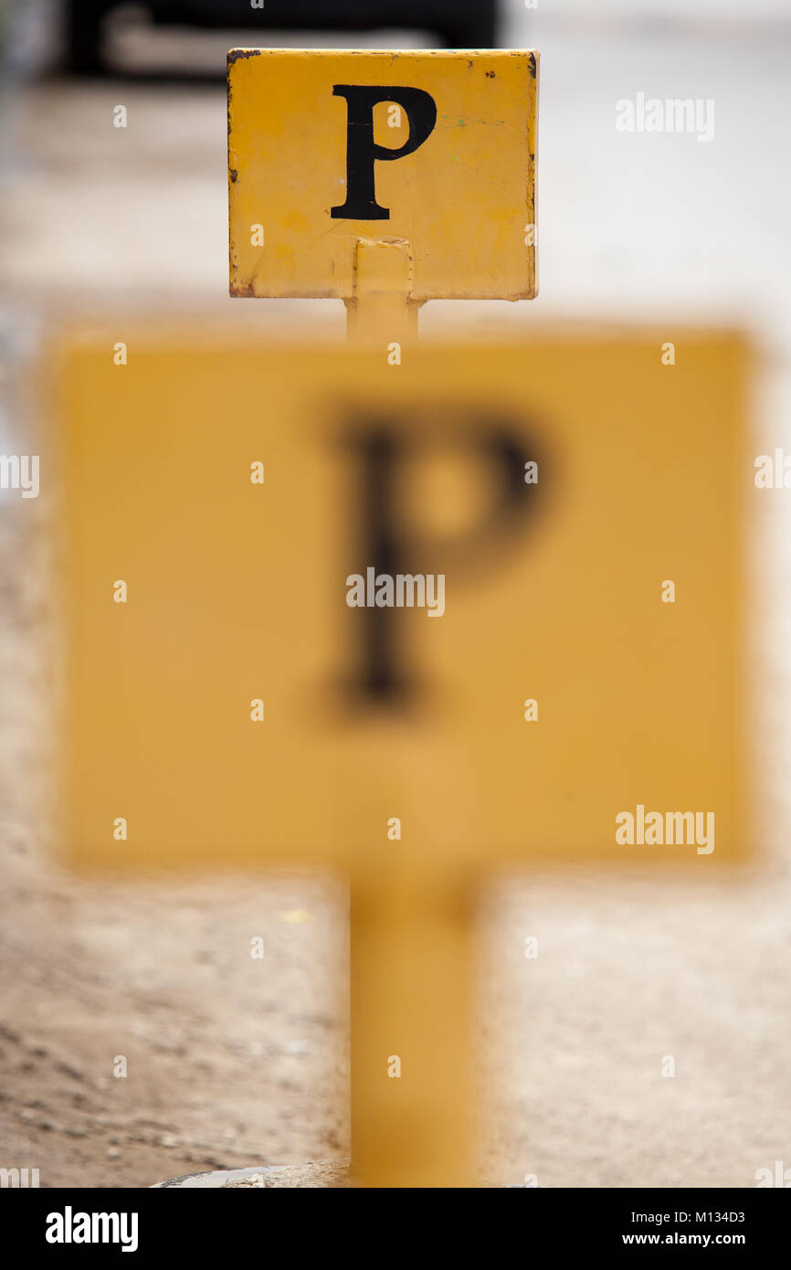 Simple parking signs made from poles and used tyres Stock Photo - Alamy