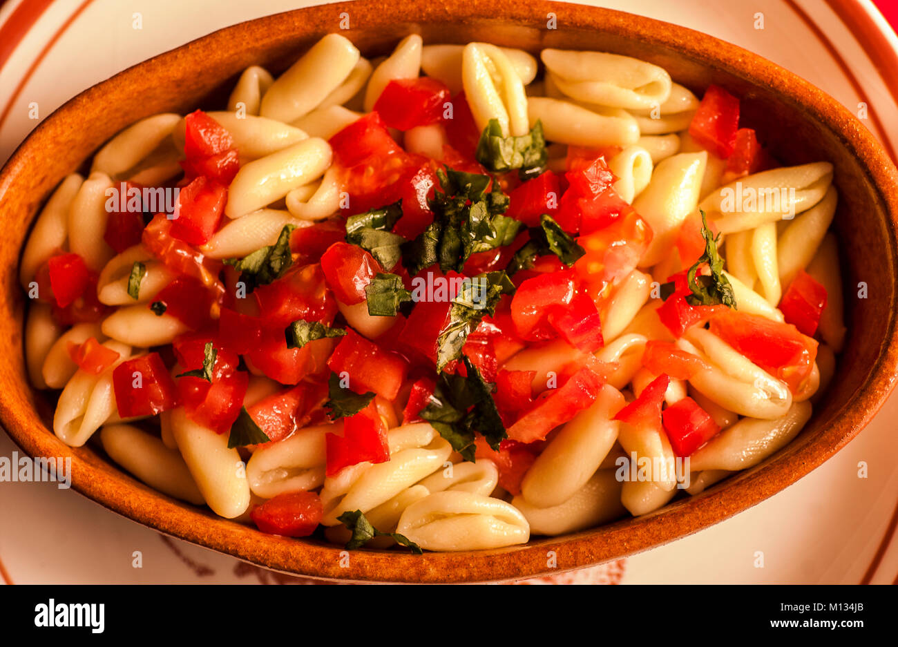 Italy Apulia Cavatelli pasta Fresh tomato and basil Stock Photo - Alamy