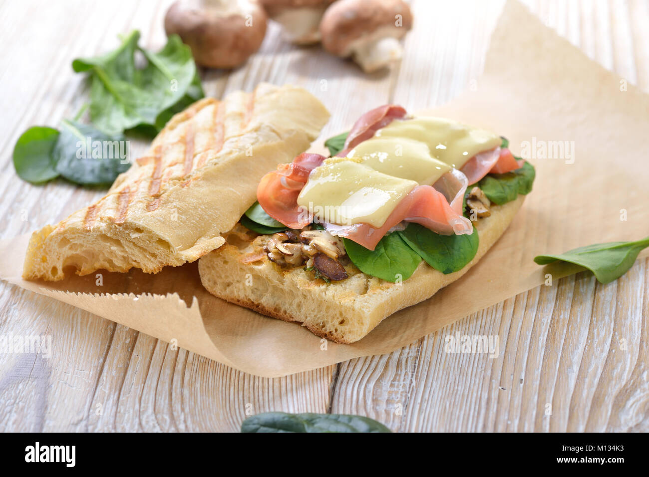 Street food: Hot Panini with Spanish Serrano ham and young spinach ...