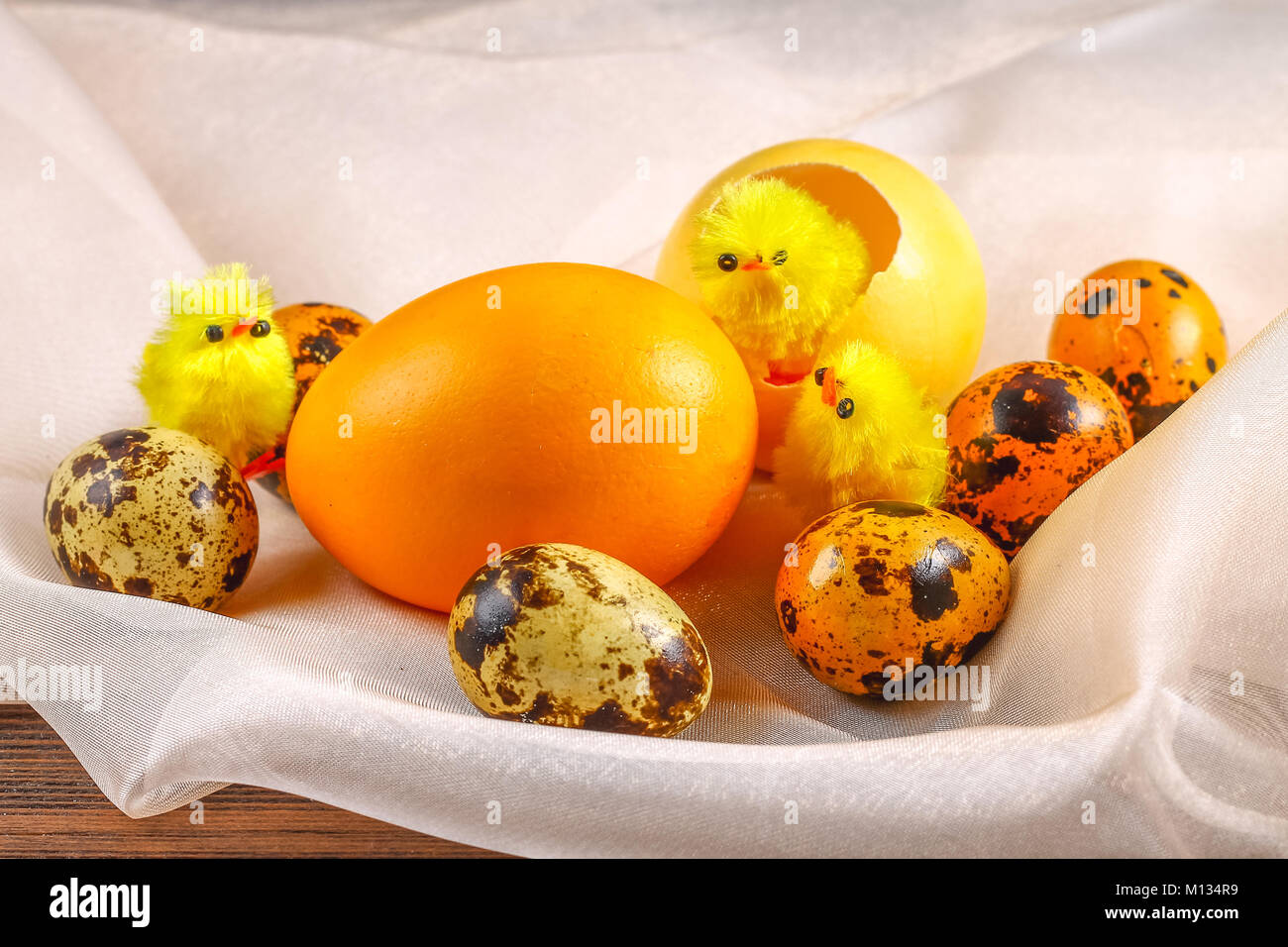 Yellow easter eggs on a brown wooden table Stock Photo - Alamy