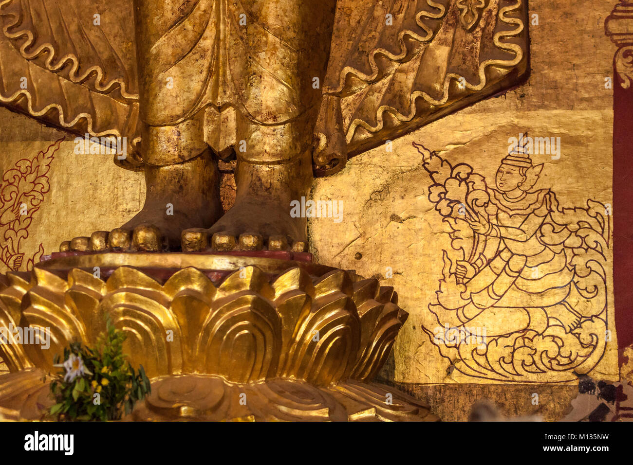 BAGAN, MYANMAR - NOVEMBER, 2016: Detail of a golden wood statue of ...