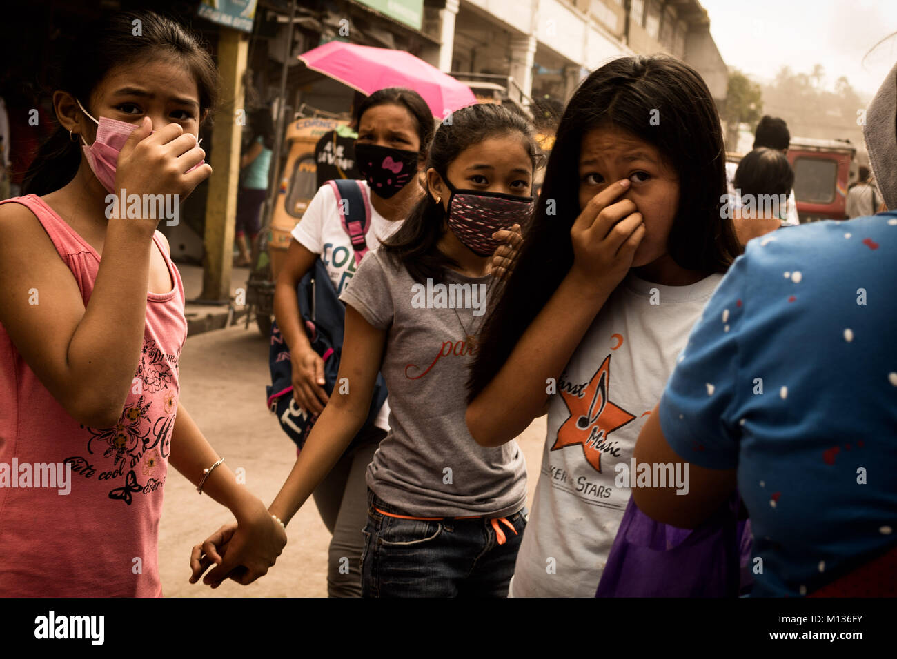 Bicol, Philippines. 25th January, 2018. A group of girls cover their ...