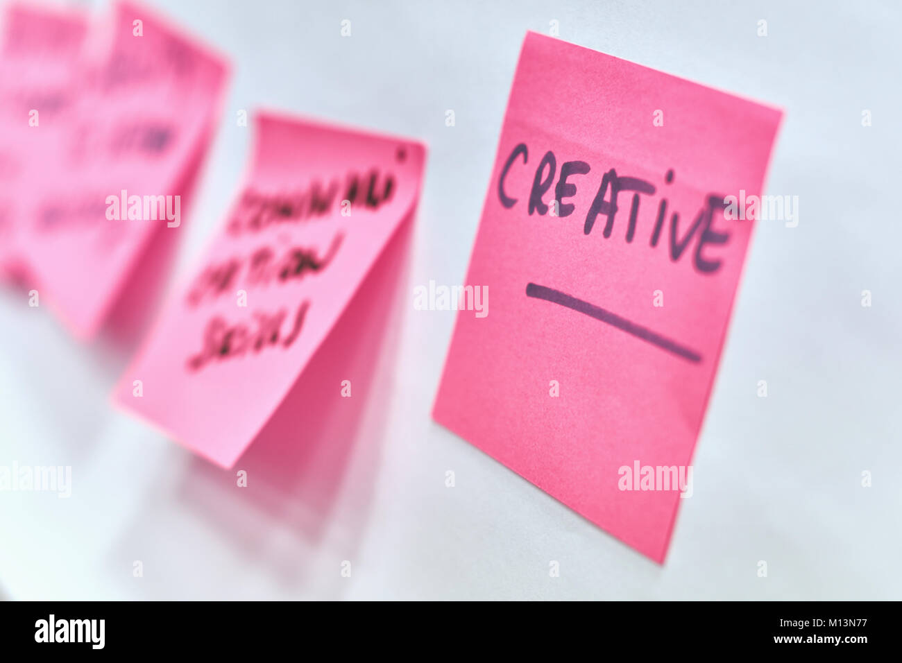 Creative written on pink paper stickers attached to a flip chart Stock ...