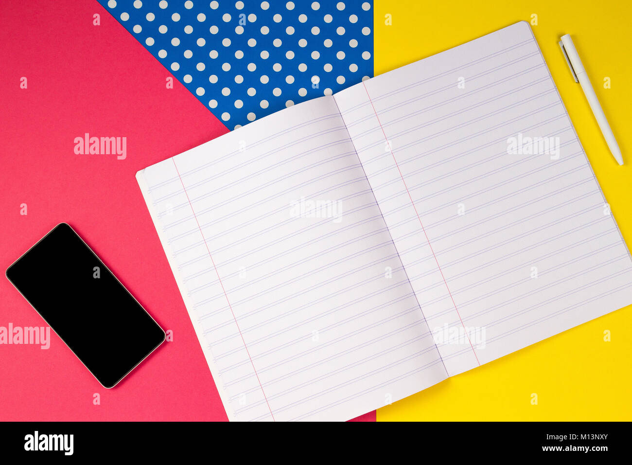 Mobile phone, open notebook and white pen on colorful background Stock ...