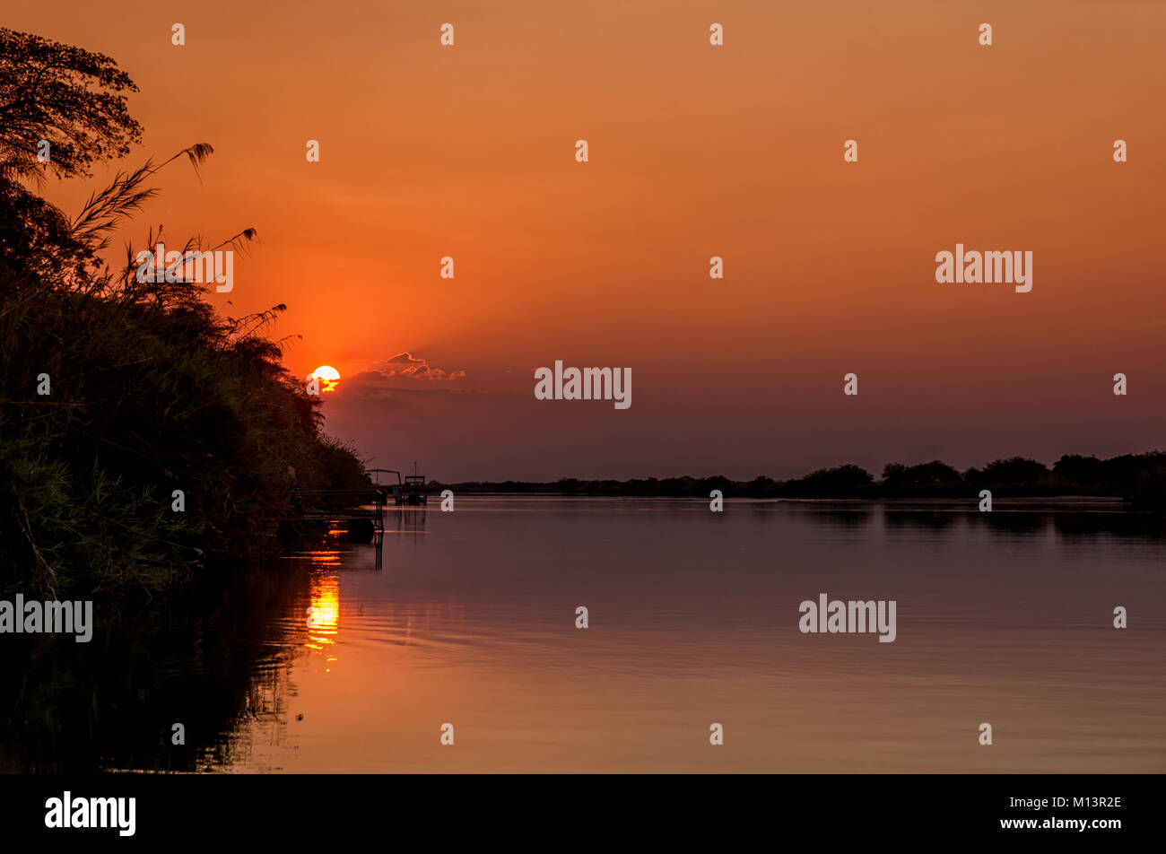 A peaceful sunset over a river in the Caprivi Strip, Namibia Stock ...