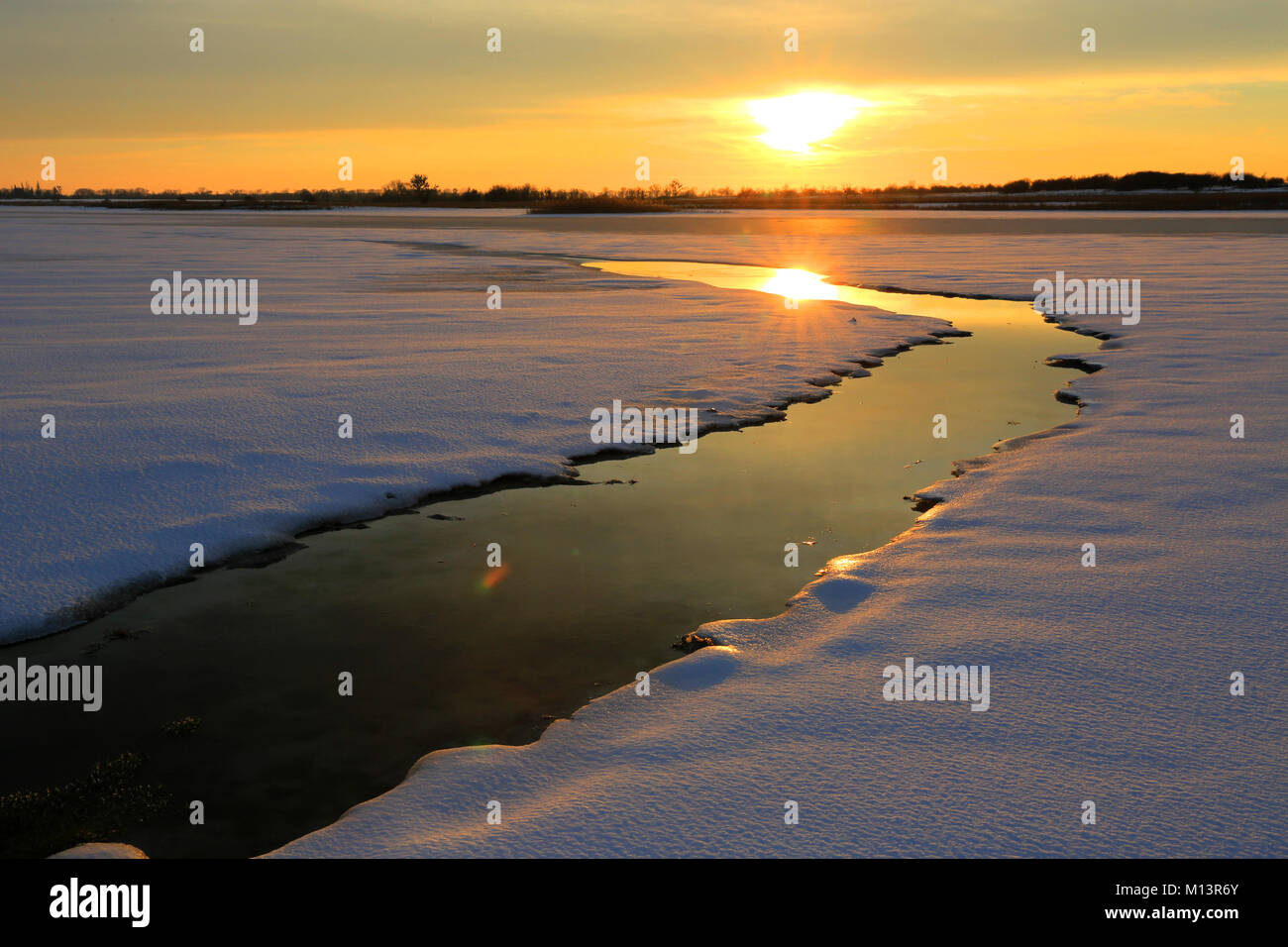 winter sunset scene on small river in steppe Stock Photo - Alamy