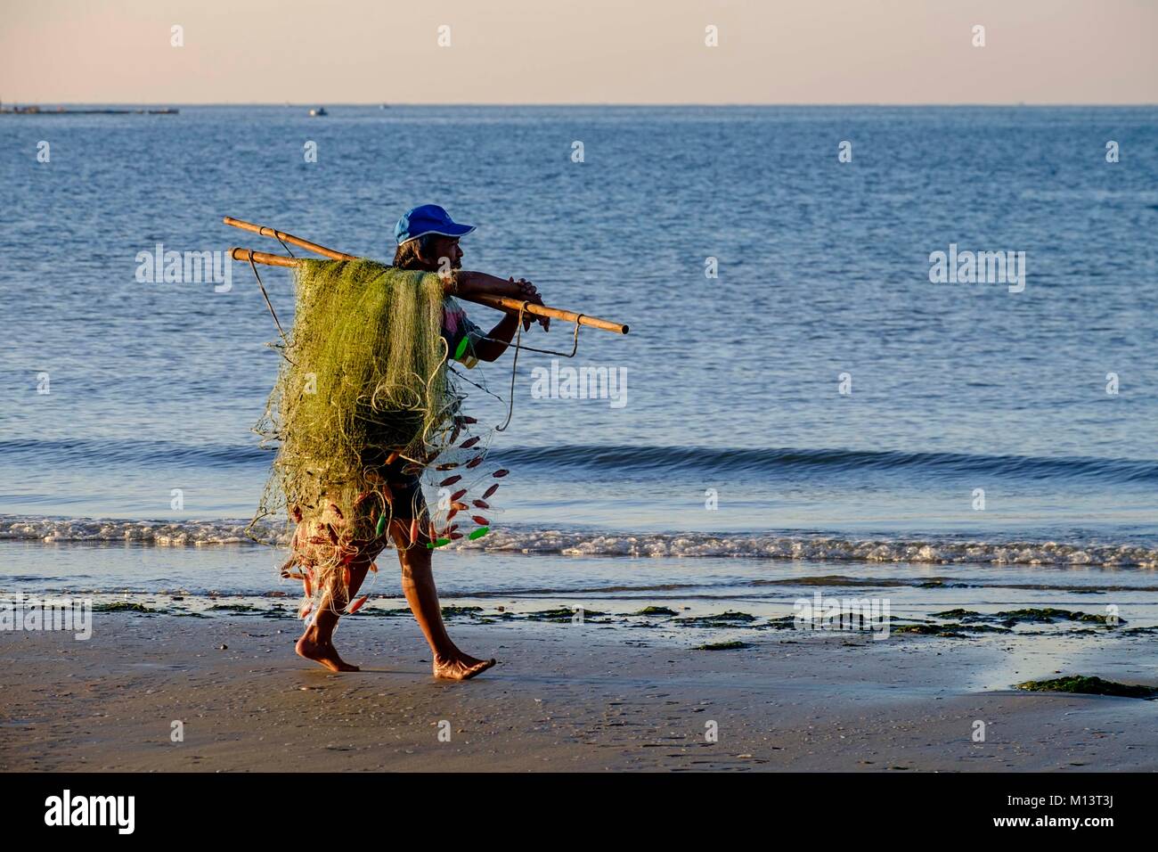 Fisherman carrying fishing net hi-res stock photography and images - Alamy