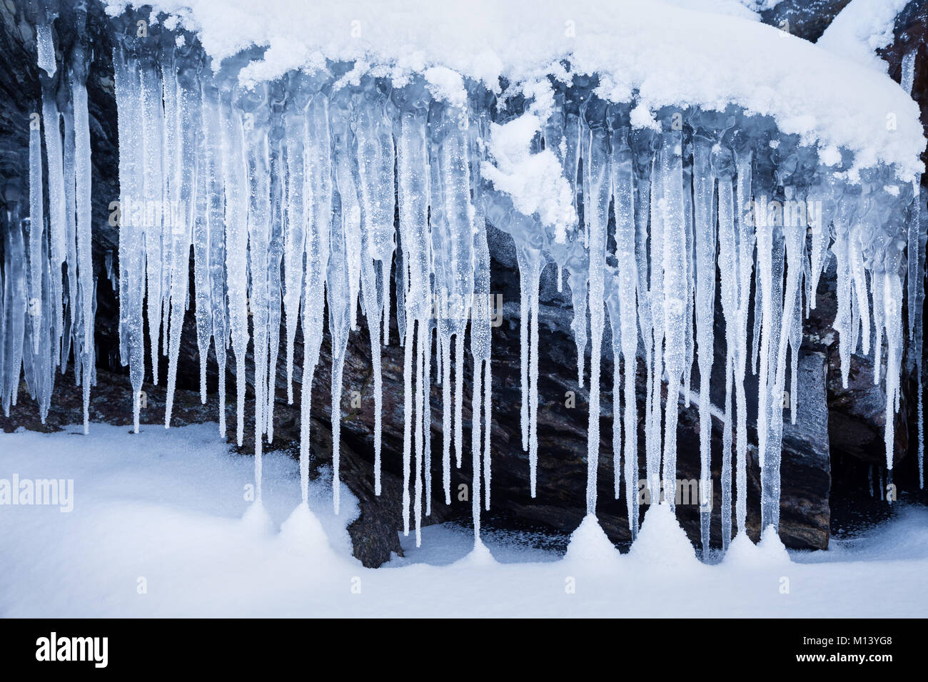 Row of frosty icicles in nature Stock Photo - Alamy