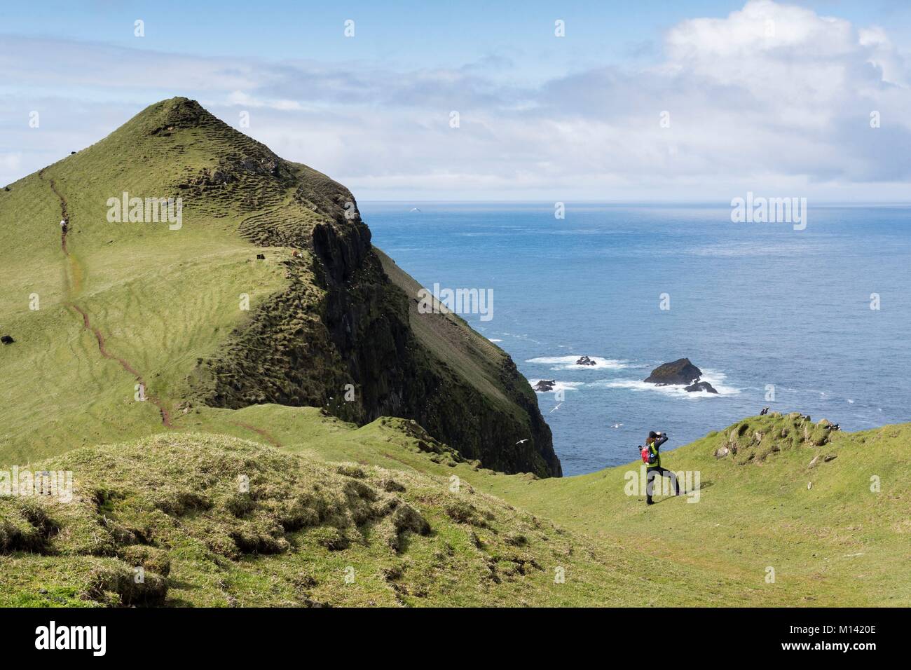 Denmark, Faroe Islands, Mykines Island, hiker Stock Photo - Alamy