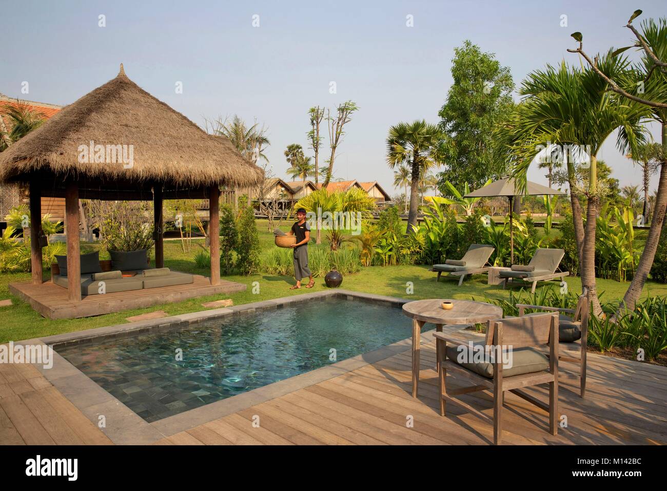 Cambodia, Siem Reap, swimming pool of a private villa in the middle of ...
