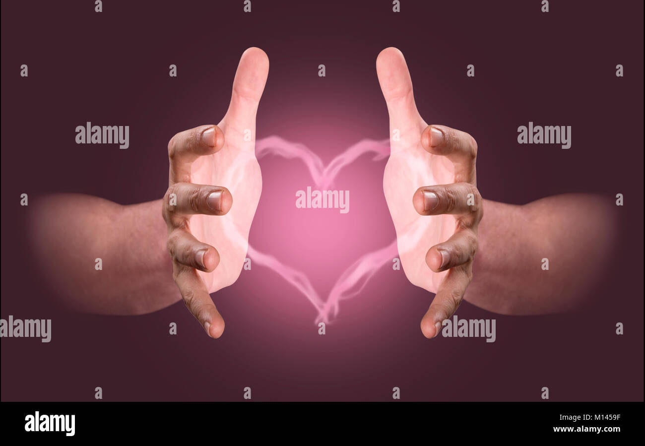 A pair of male hands conjuring up a pink heart shaped vapor on an ...