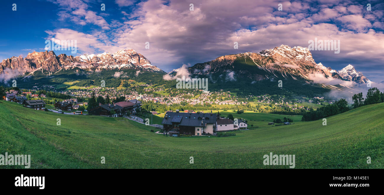 Cortina d'Ampezzo town panoramic view with alpine green landscape and ...