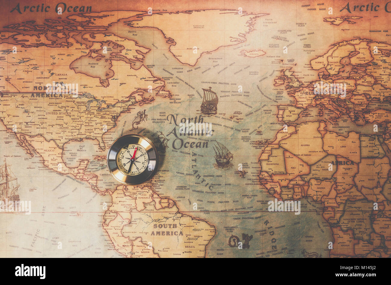 Columbus day and world map with compass Stock Photo - Alamy
