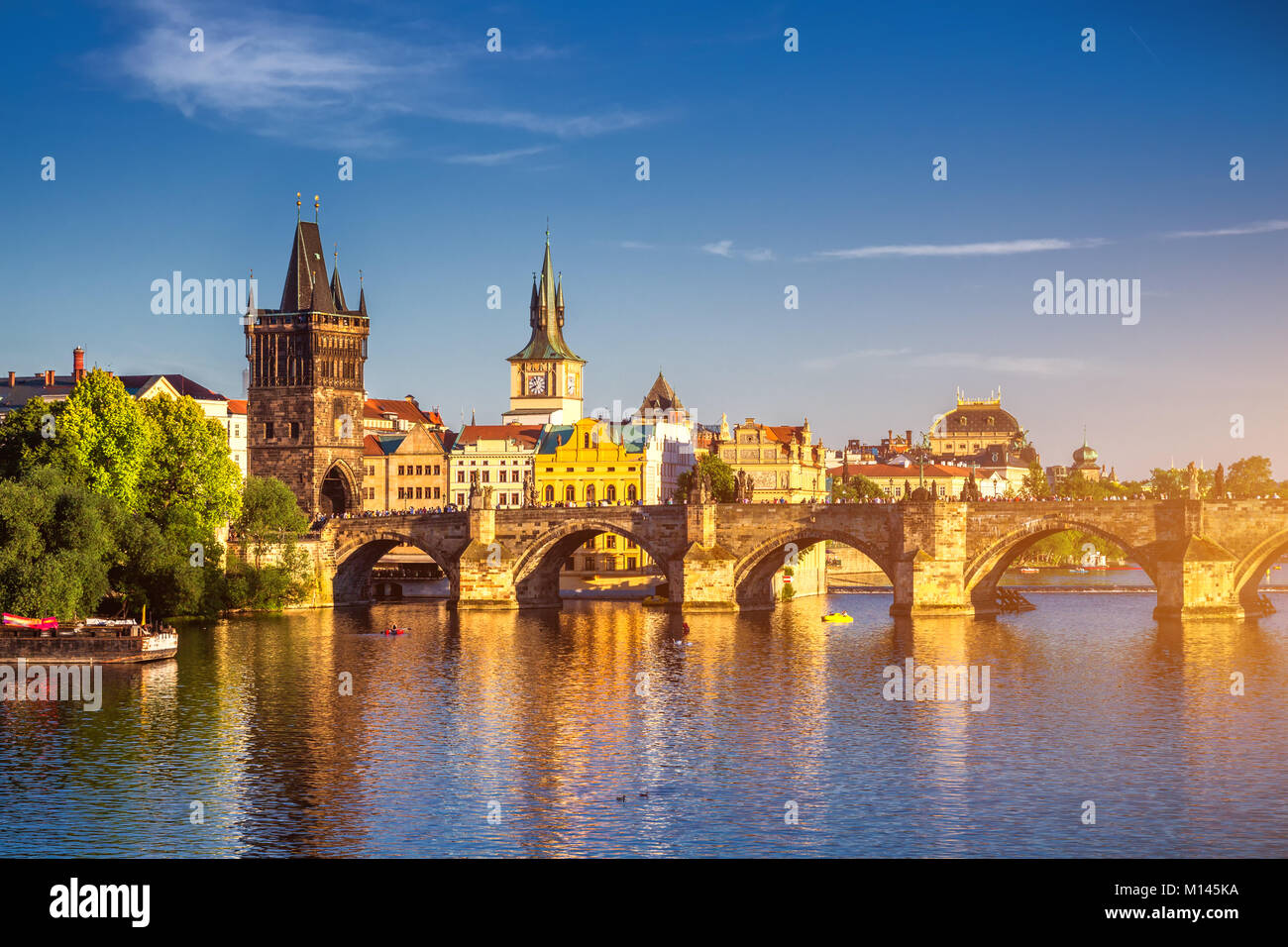 View of the Vltava River and the bridges shined with the sunset sun ...