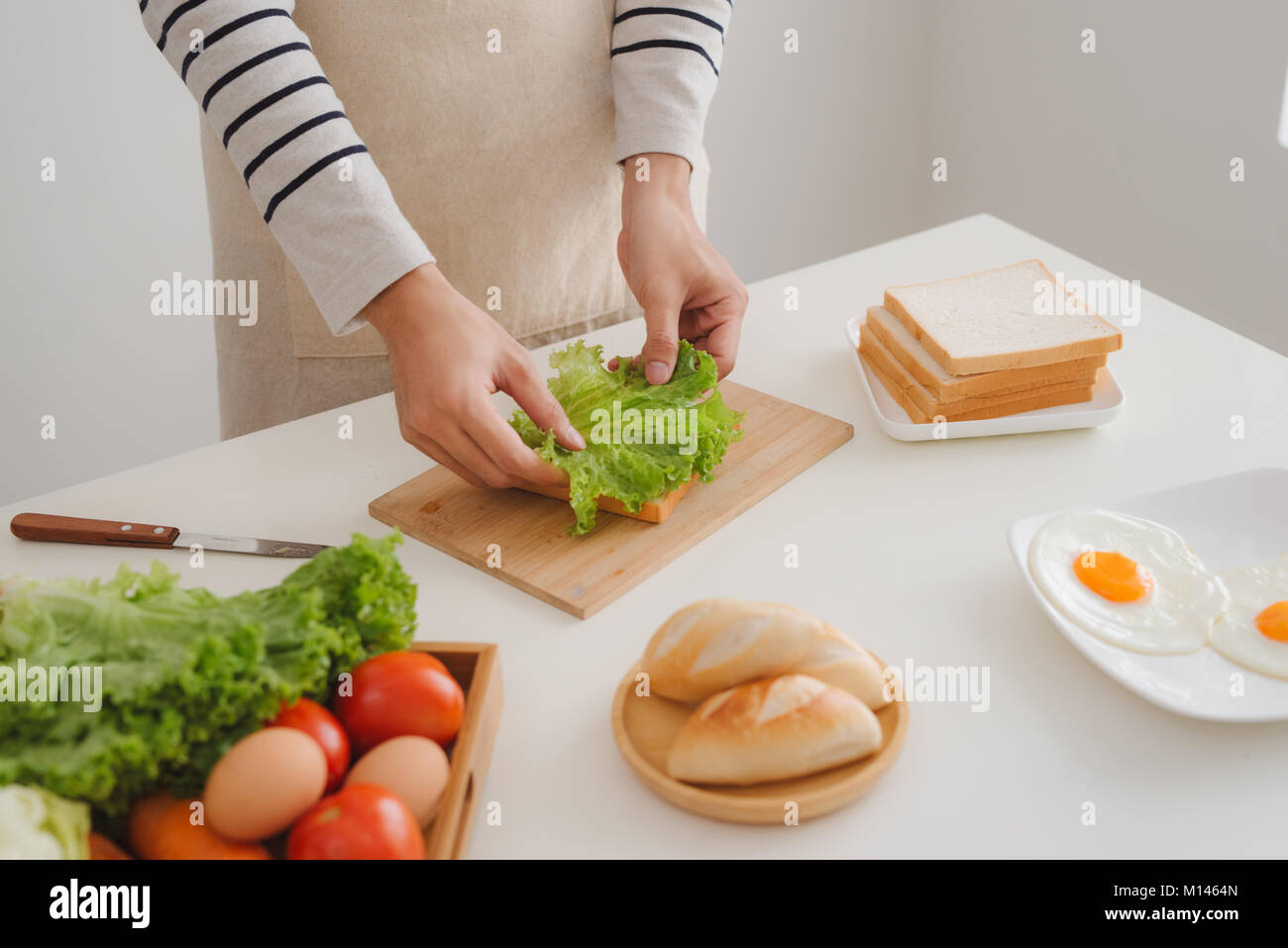 Hands of man prepare sandwich at home Stock Photo - Alamy