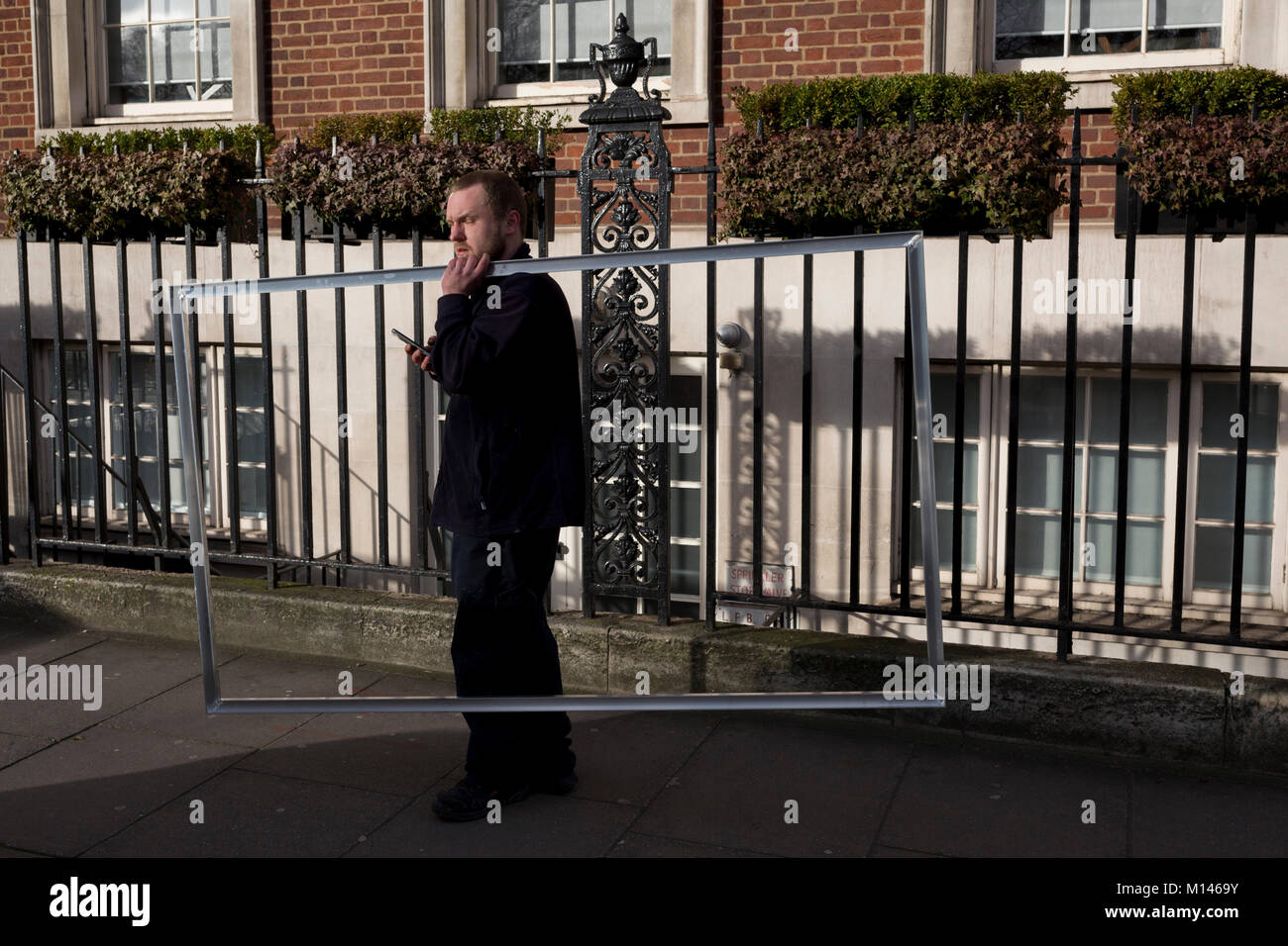 A workman delivers a rectangular frame, on 17th January 2018 in ...